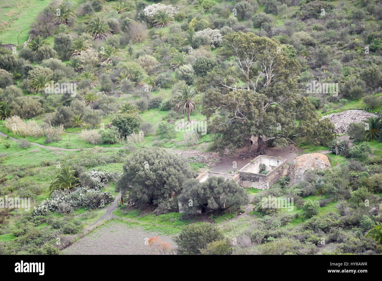 House without roof inside the crater of a mountain Stock Photo - Alamy
