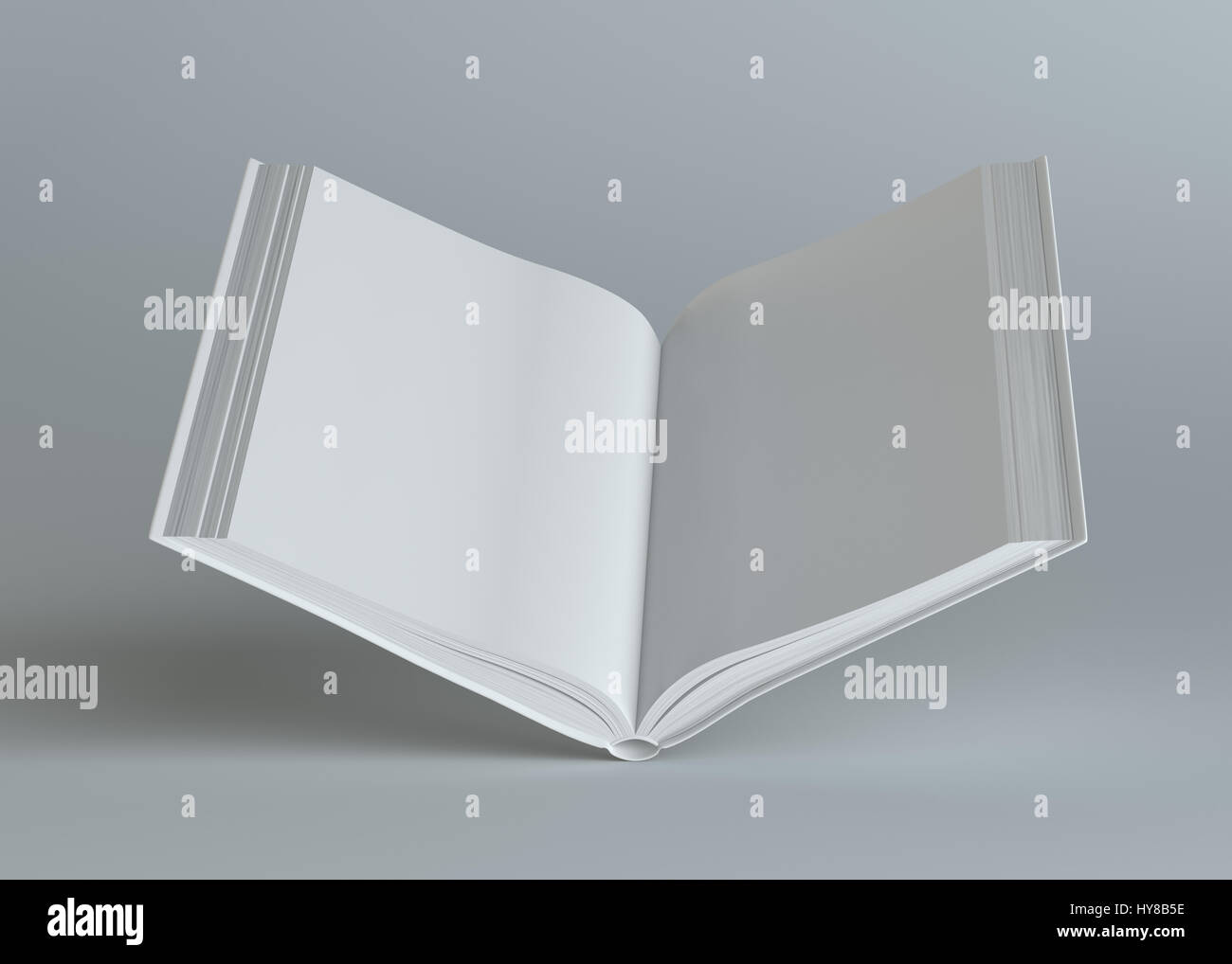 White empty open book on gray background Stock Photo - Alamy
