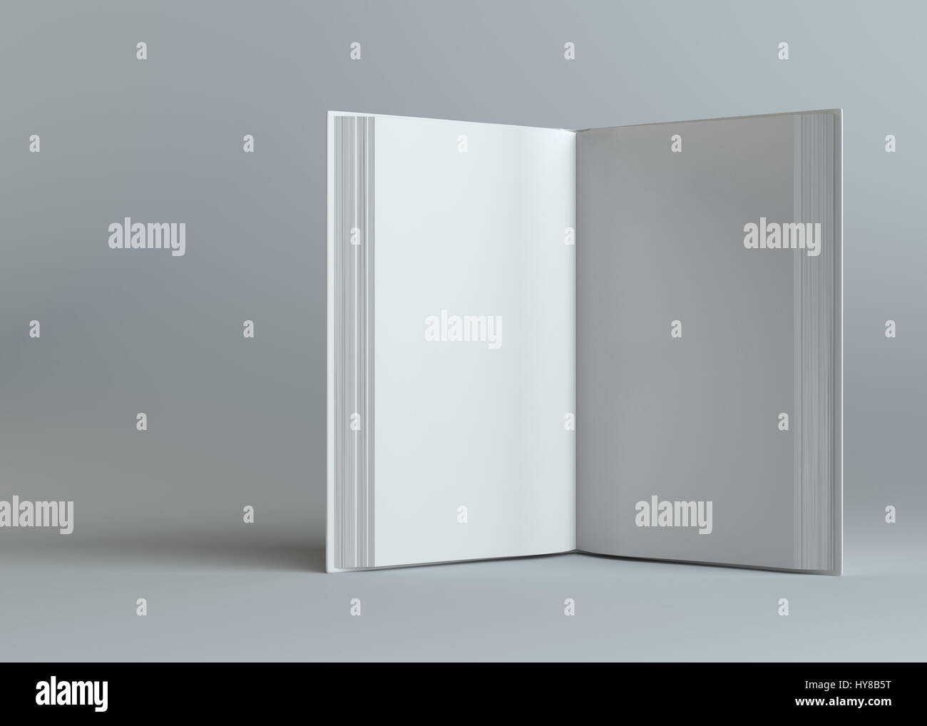 White empty open book on gray background Stock Photo - Alamy
