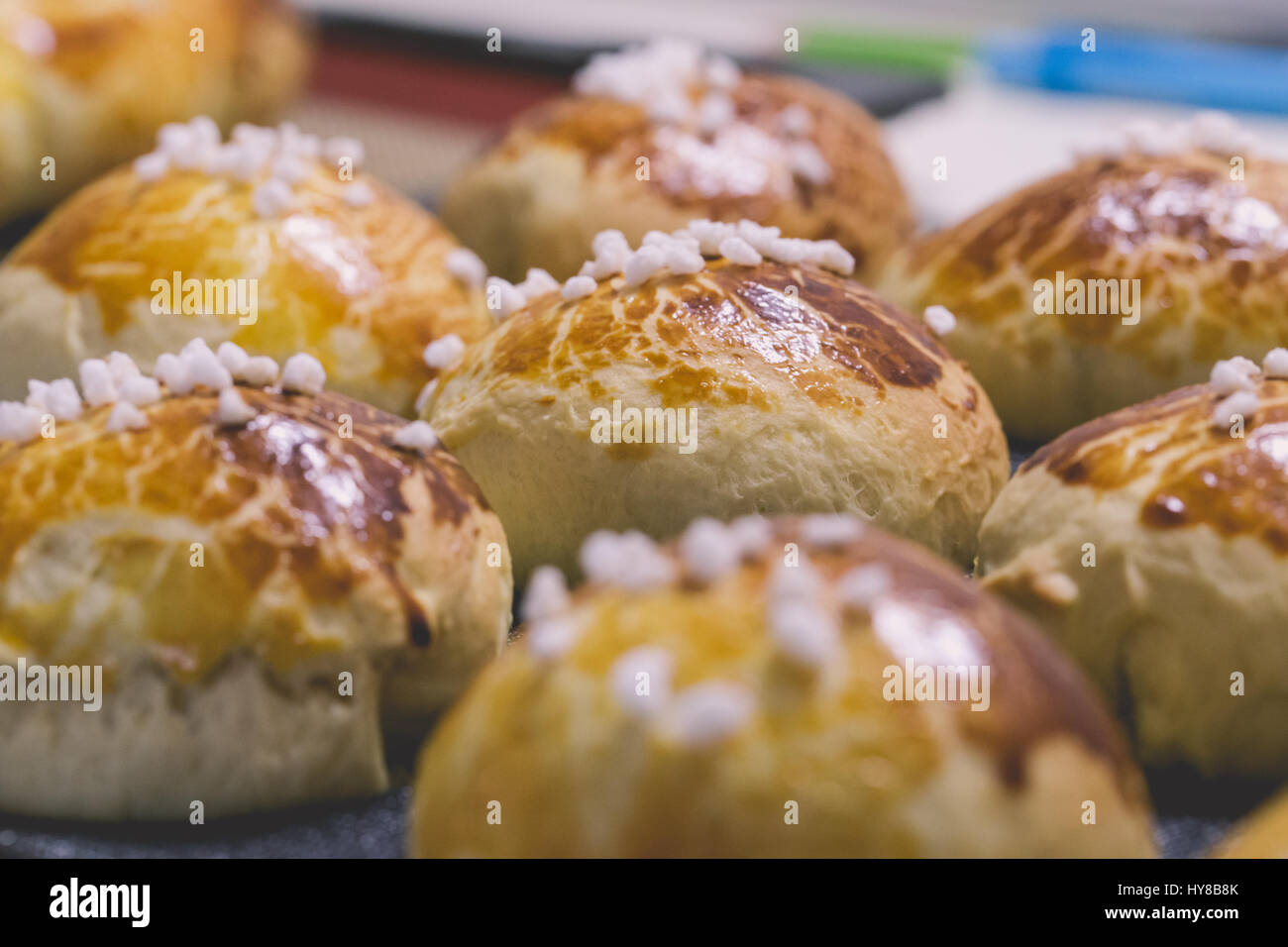 Freshly baked hot artisan bread buns beautifully decorated out of the ...