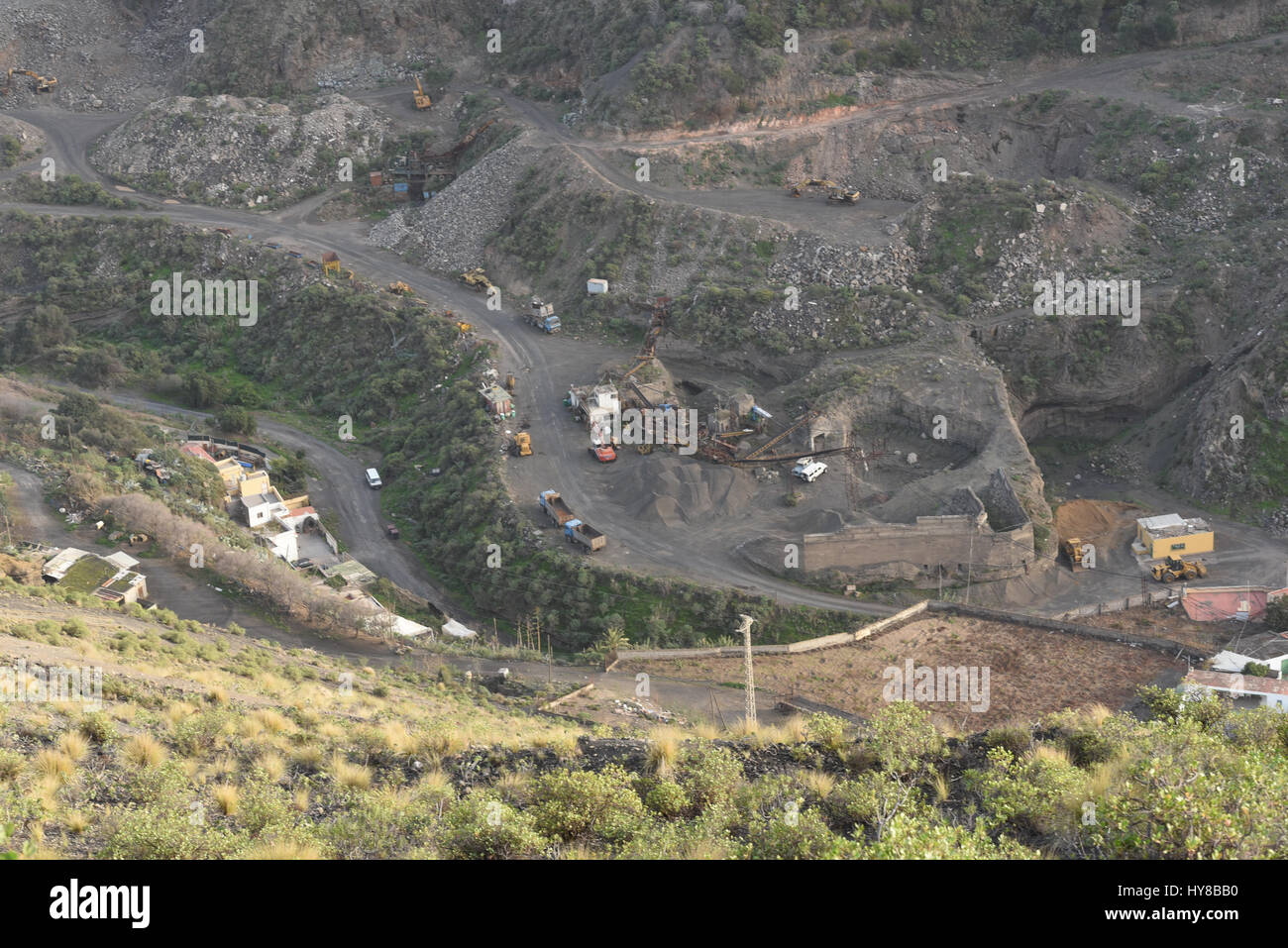 Heavy machinery parked next to stone mine from the top Stock Photo - Alamy