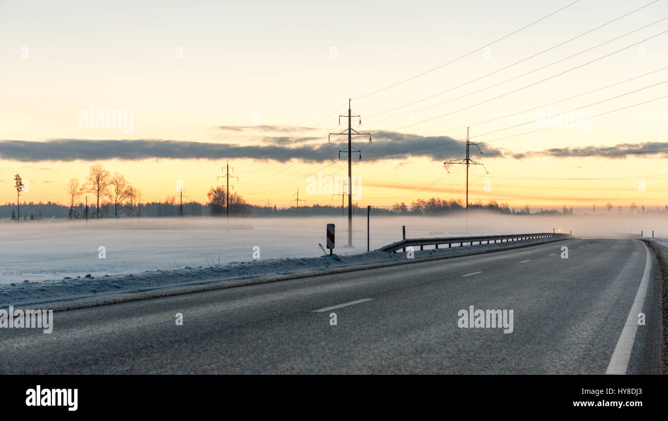 empty road in the countryside with trees in surrounding. perspective in ...