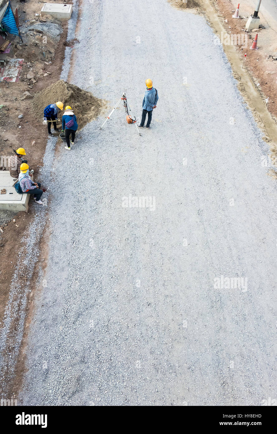 Construction worker measuring road hi-res stock photography and images ...