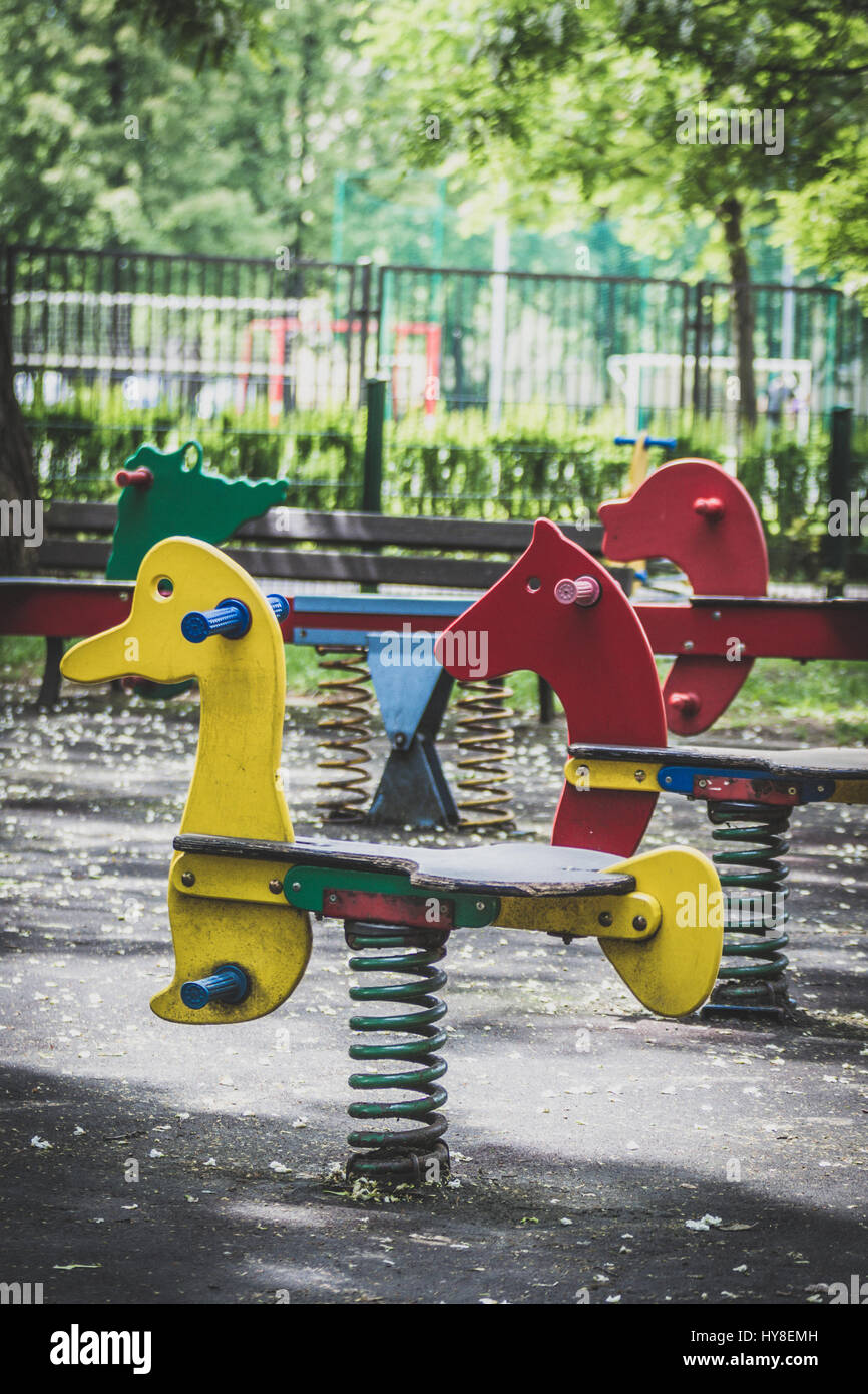 Playground rocking horses hi-res stock photography and images - Alamy