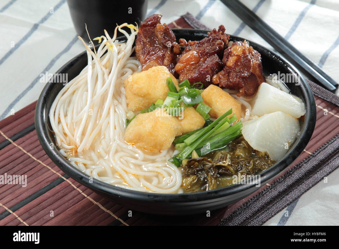 a cuisine photo of noodles with meat Stock Photo - Alamy