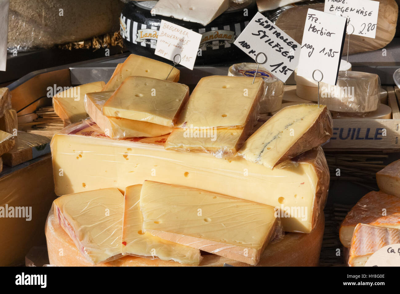 Cheese for sale at market stall in Viktualienmarkt., Munich, Germany ...
