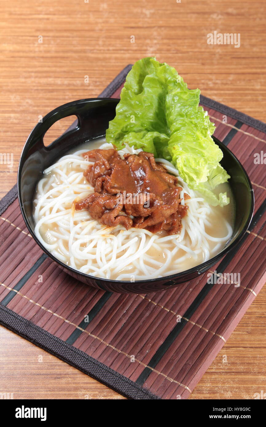 a cuisine photo of noodles with meat Stock Photo - Alamy