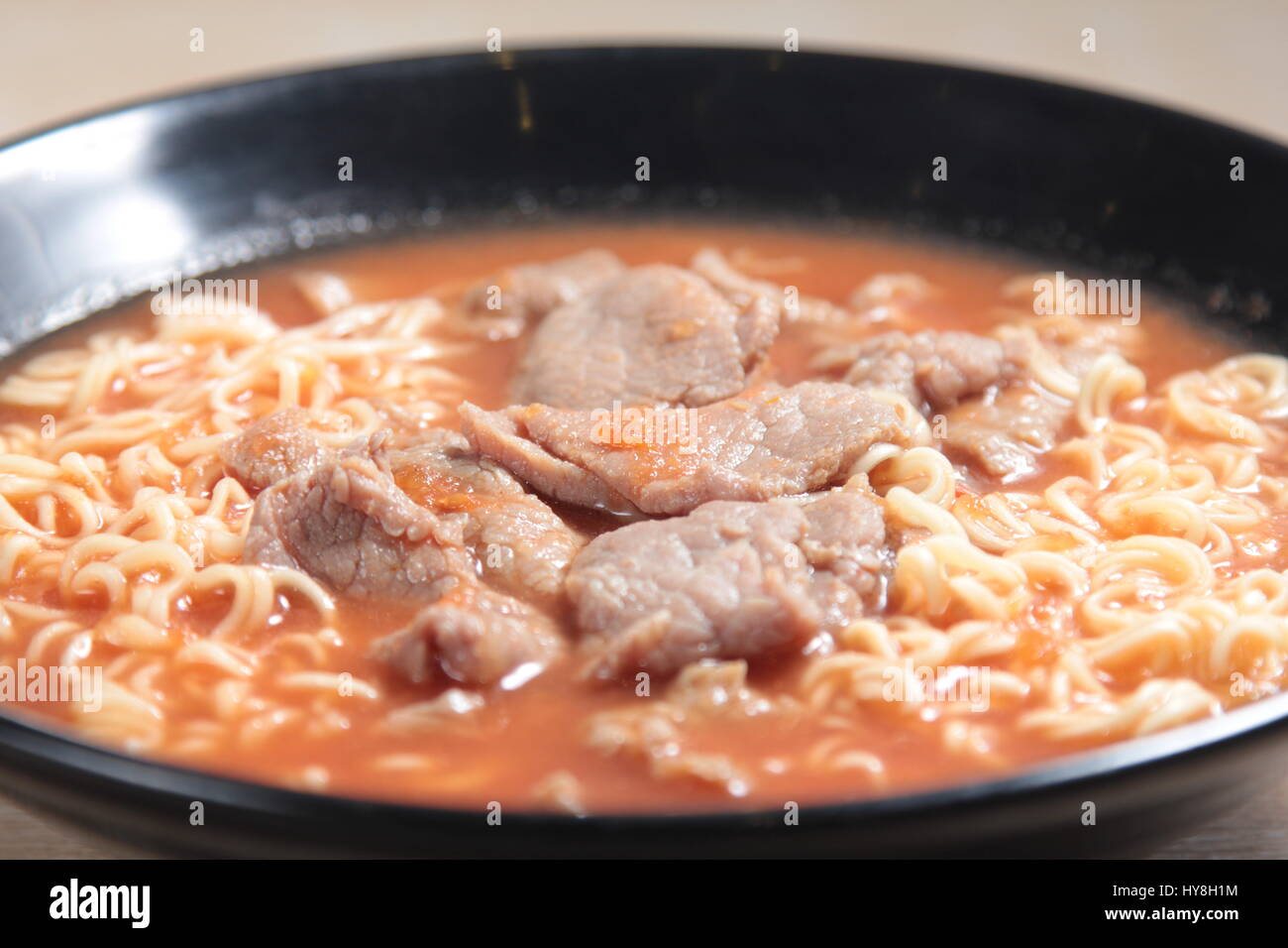 a cuisine photo of noodles with meat Stock Photo - Alamy