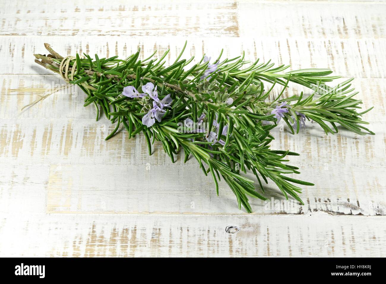 bunch of fresh rosemary on wooden background Stock Photo - Alamy
