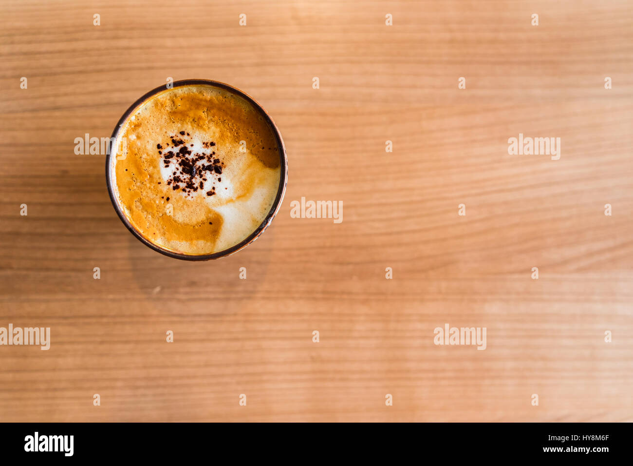 Hot Coffee Mocha on the brown wooden table with chocolate. Top view ...