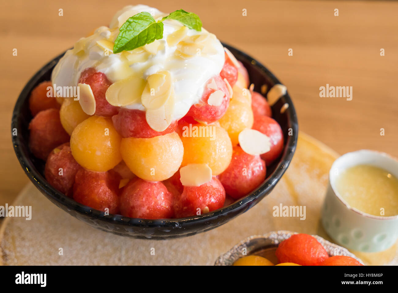 Watermelon and Melon bingsu on a wood tray, Korean ice dessert Stock ...