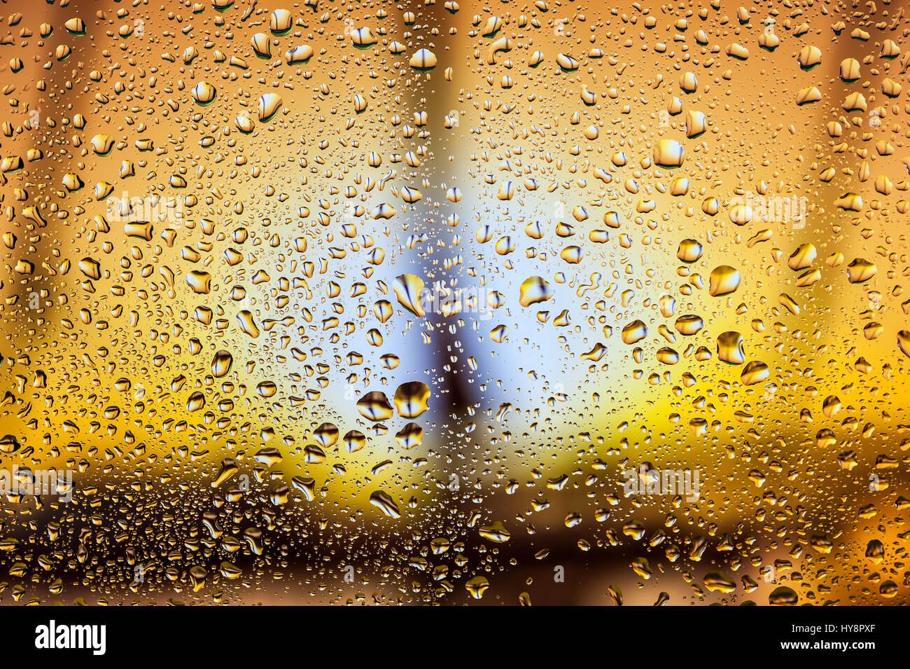 Abstract texture - Water drops on glass with orange harbor background ...