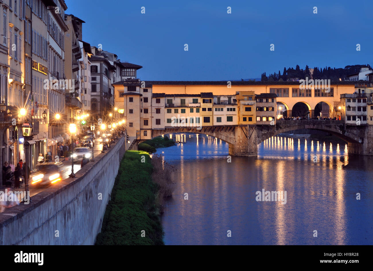 Ponte Vecchio bridge over the river Arno. Bridge was opened in 1345 and ...