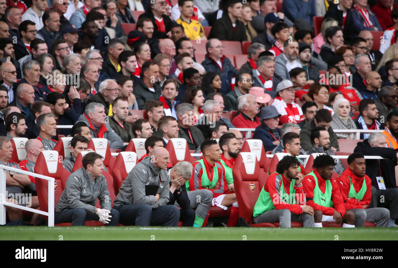 Arsenal manager Arsene Wenger (centre) reacts on the bench during the ...