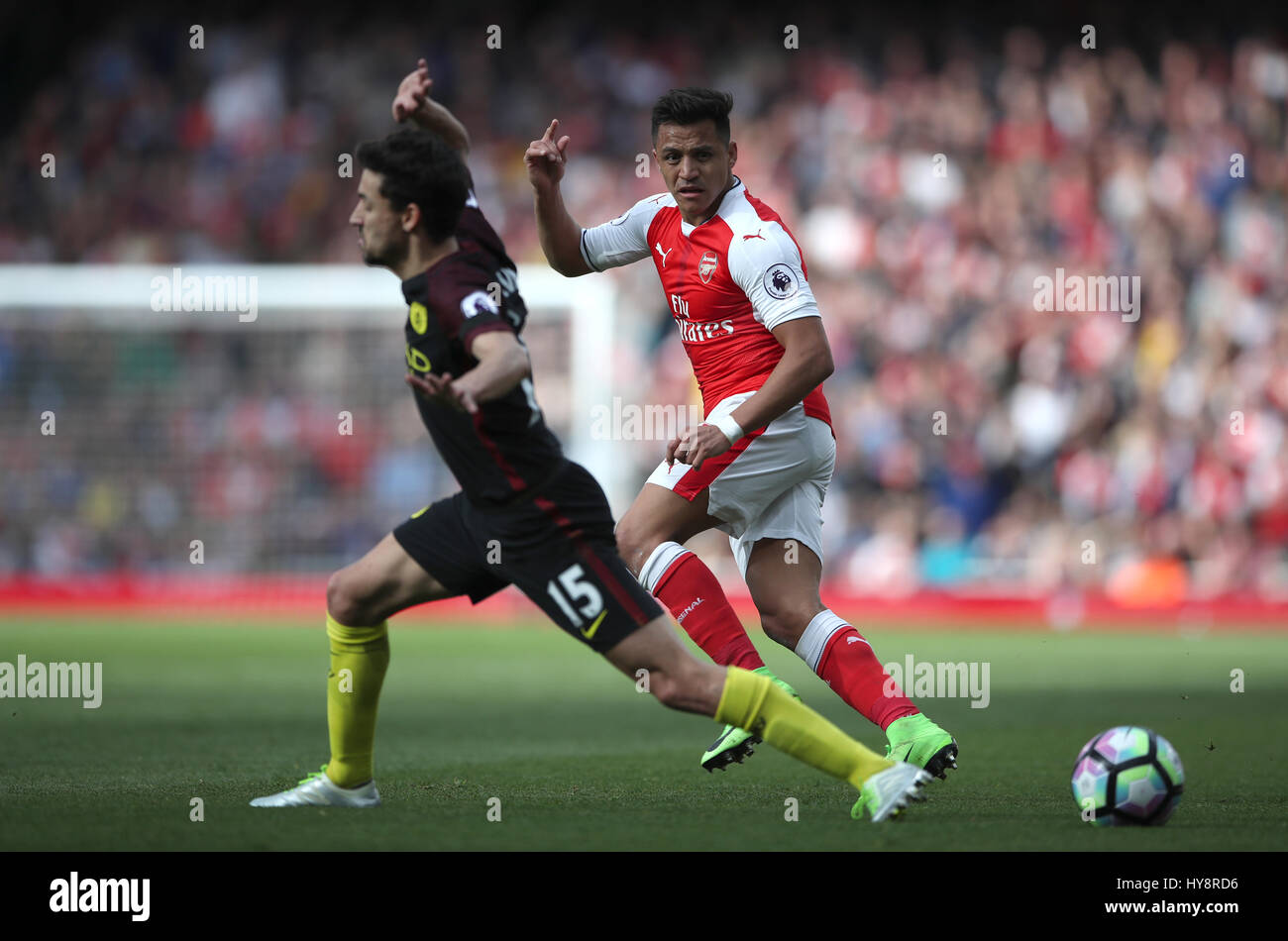 Arsenal's Alexis Sanchez (right) Manchester City's Jesus Navas during ...