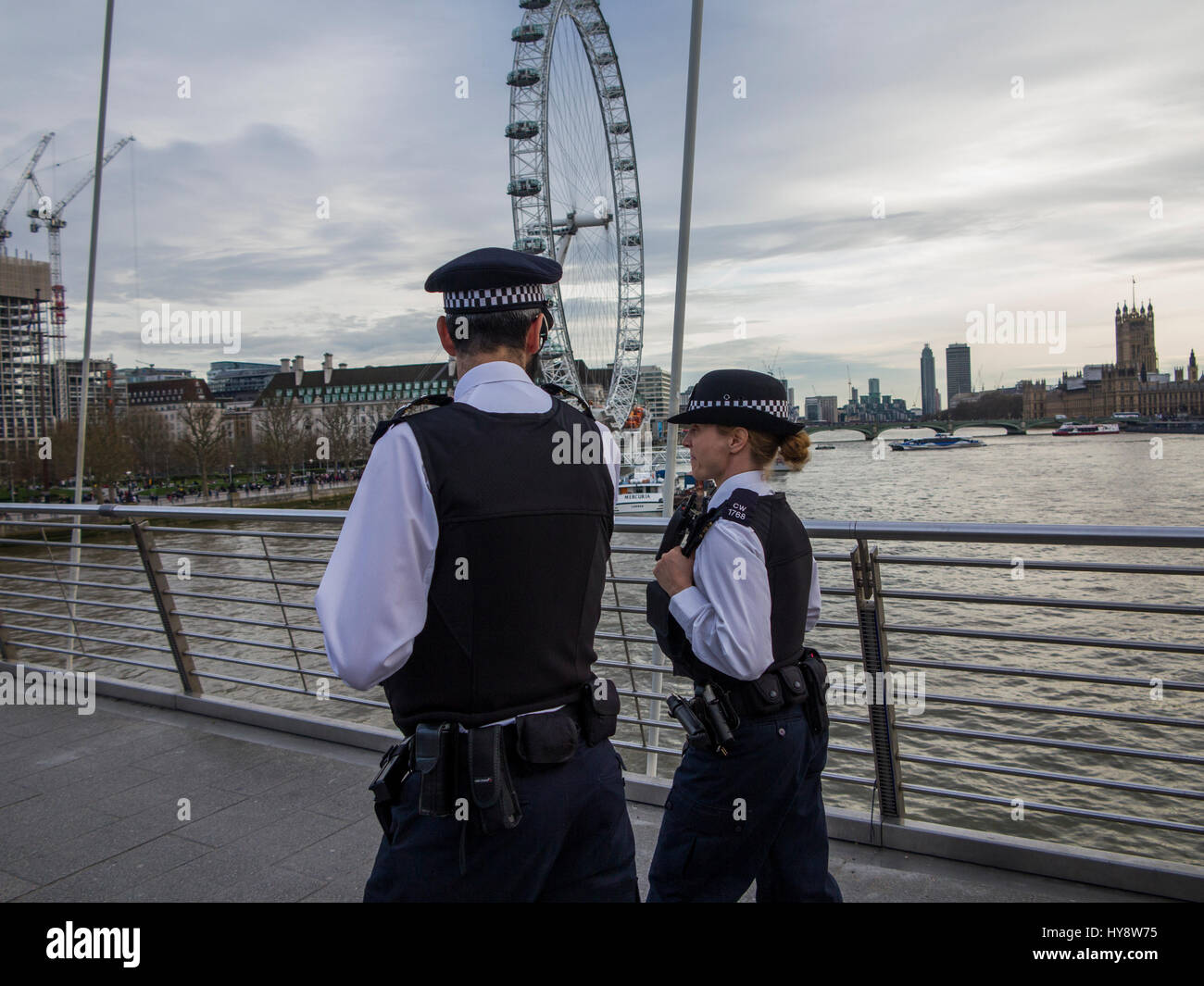 A police man and woman patrolling in London Stock Photo - Alamy