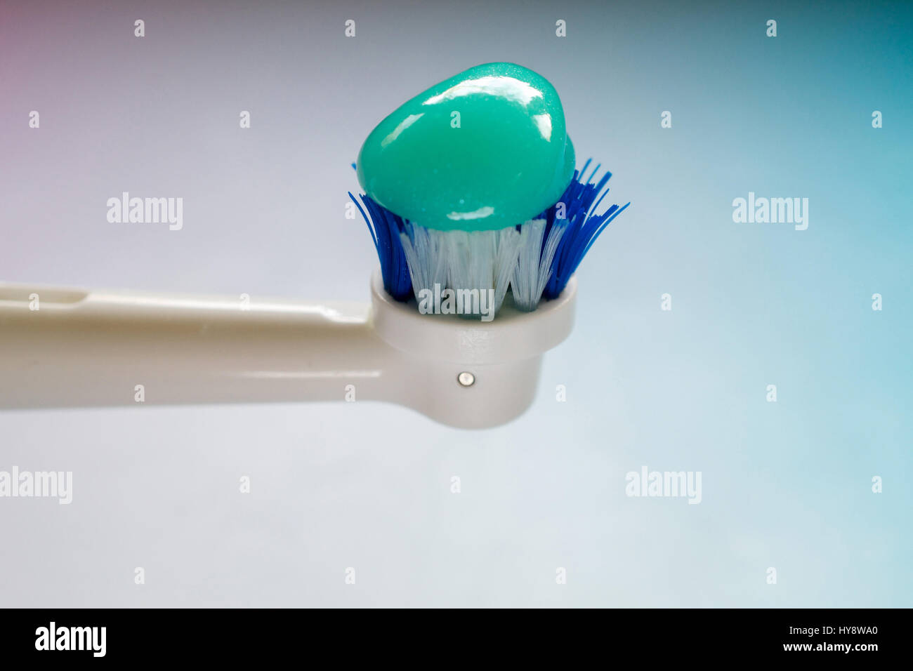 Close-up on the side of a worn-out white and blue head of an electric ...