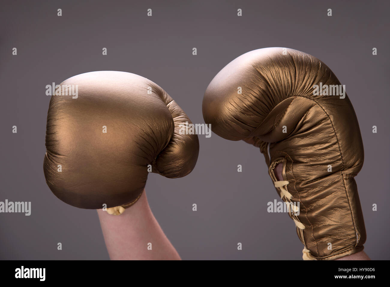 Gold boxing gloves hi-res stock photography and images - Alamy