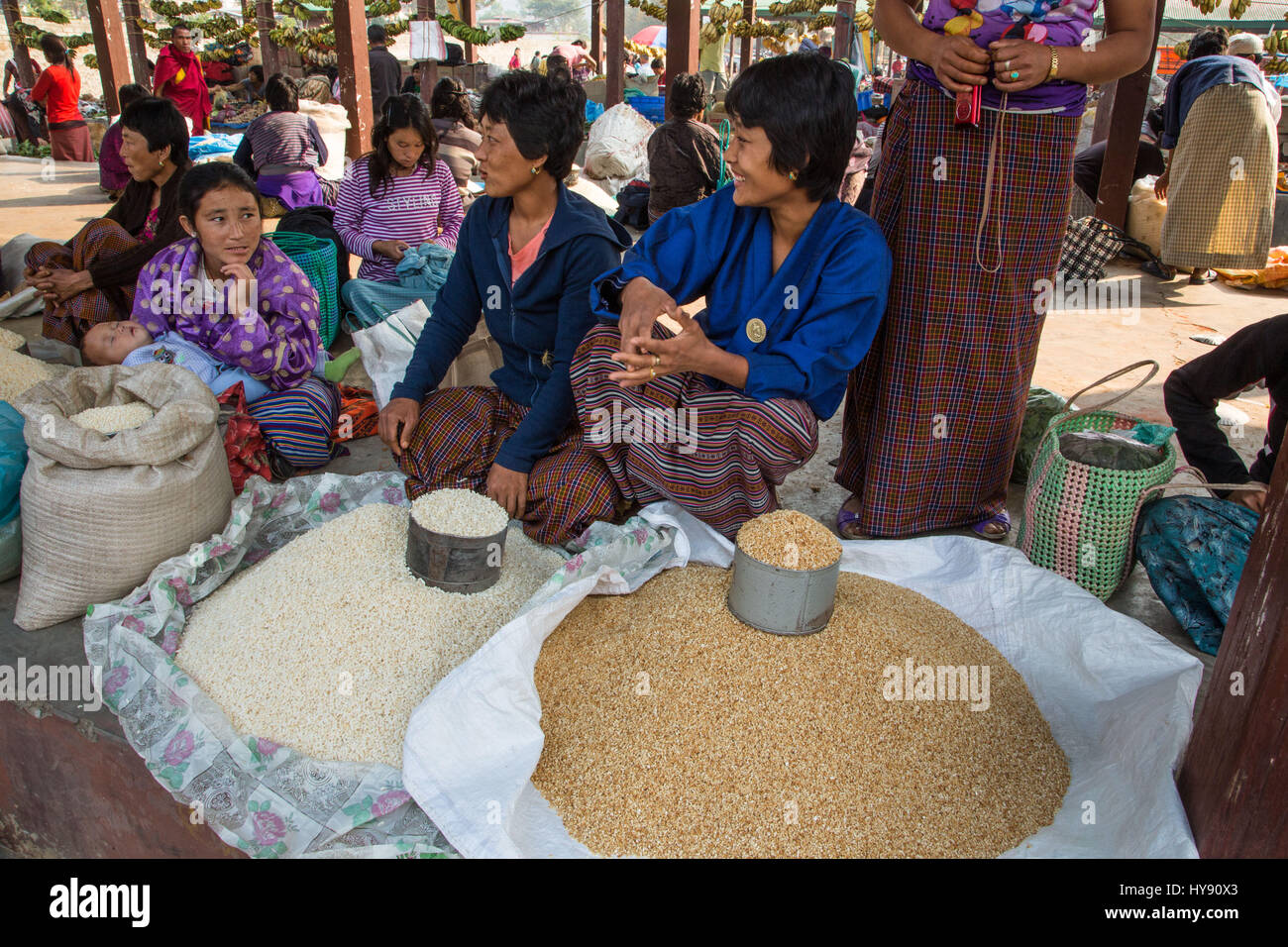 Women selling rice in the farmers market in Punakha, Bhutan Stock Photo ...
