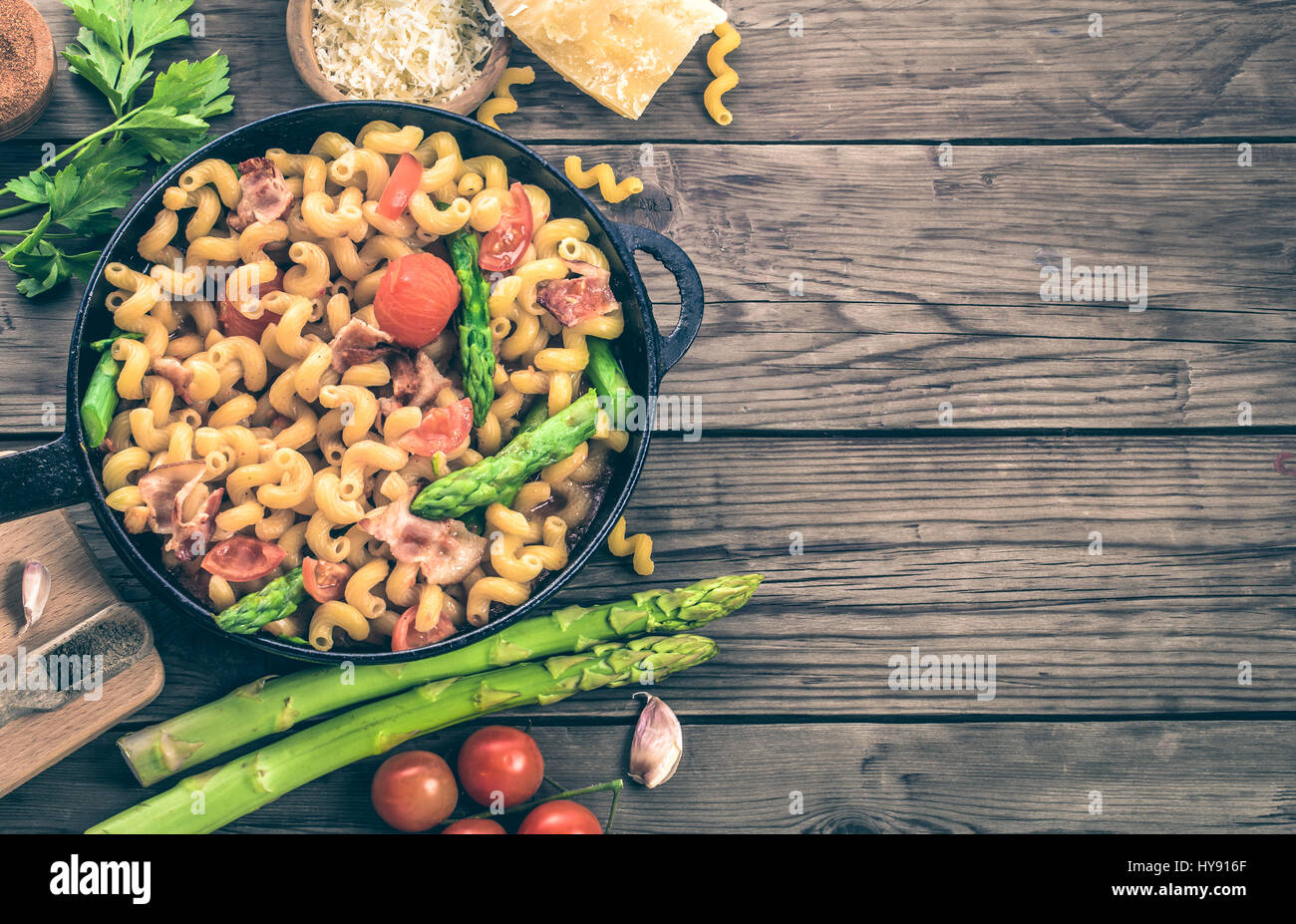 Cavatappi pasta in frying pan above Stock Photo - Alamy