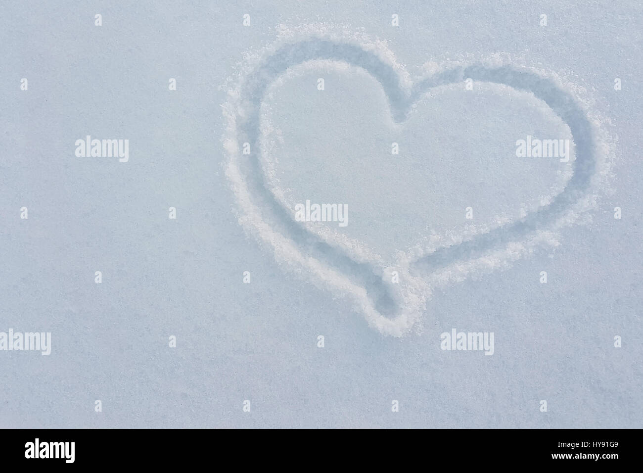 Big Heart on the snow, a declaration of love, drawing on a soft blue ...