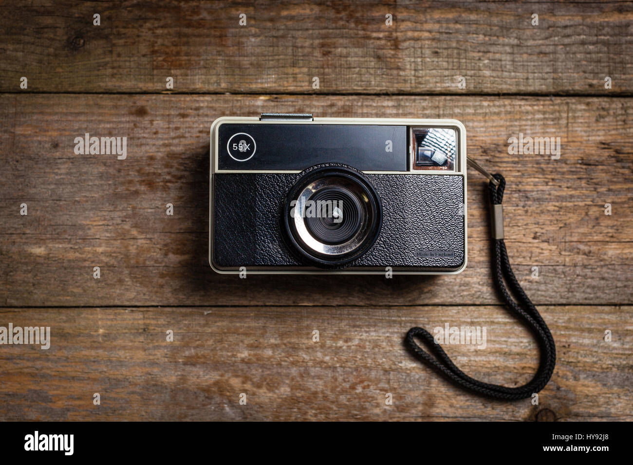Old vintage instamatic camera on a wooden background Stock Photo - Alamy