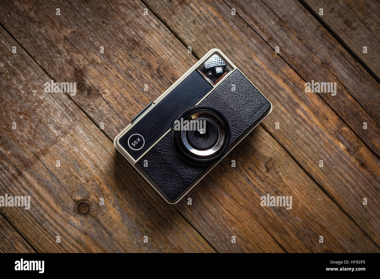 Old vintage instamatic camera on a wooden background Stock Photo - Alamy