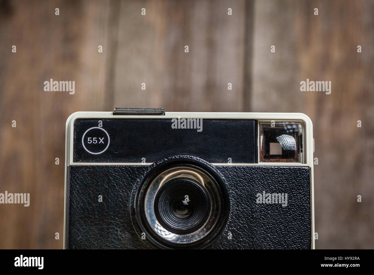 Old vintage instamatic camera on a wooden background Stock Photo - Alamy