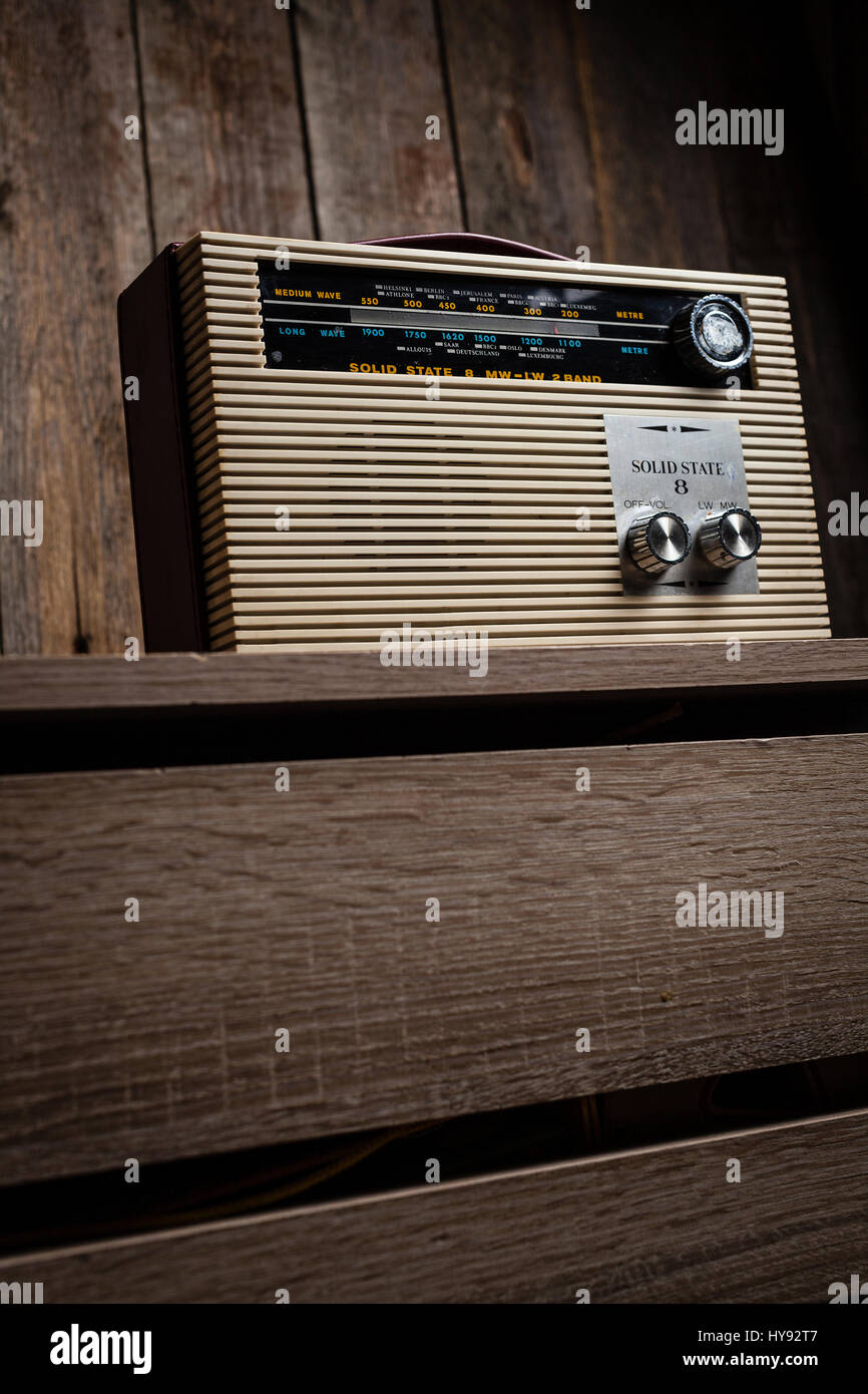 Old vintage radio on a wooden background Stock Photo - Alamy