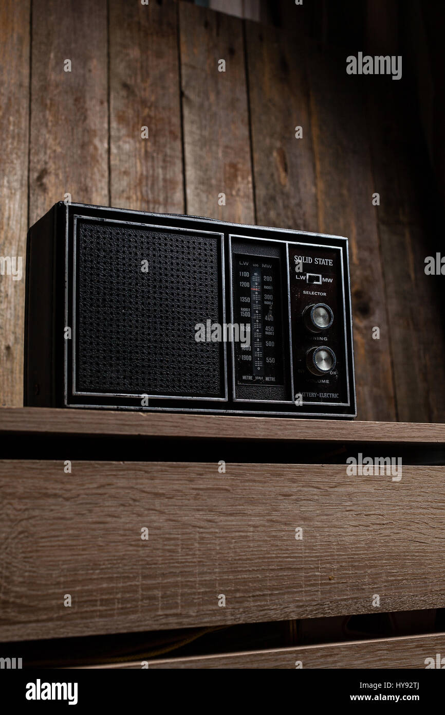 Old vintage radio on a wooden background Stock Photo - Alamy