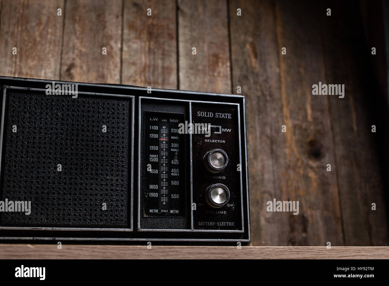 Old vintage radio on a wooden background Stock Photo - Alamy
