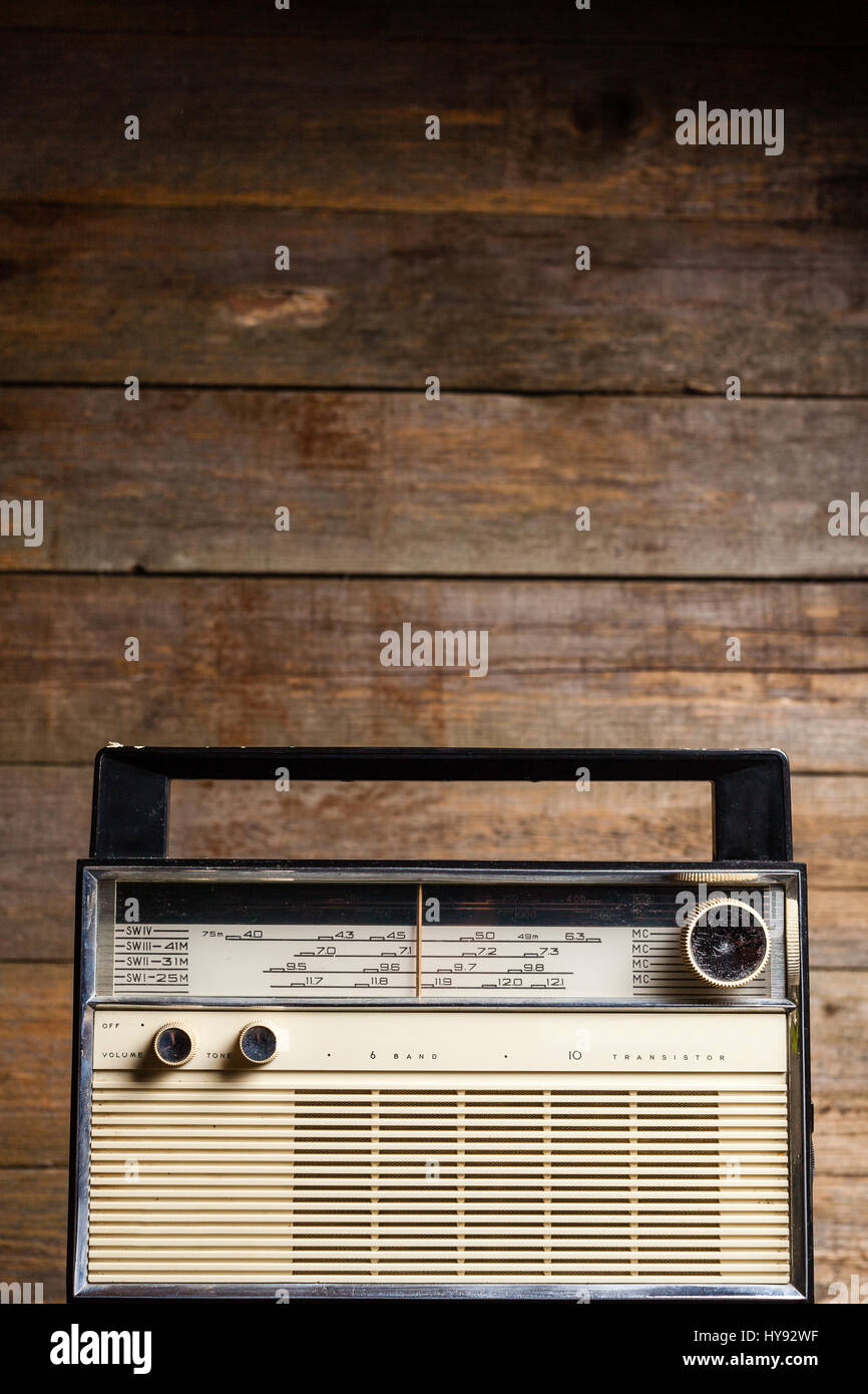 Old vintage radio on a wooden background Stock Photo - Alamy