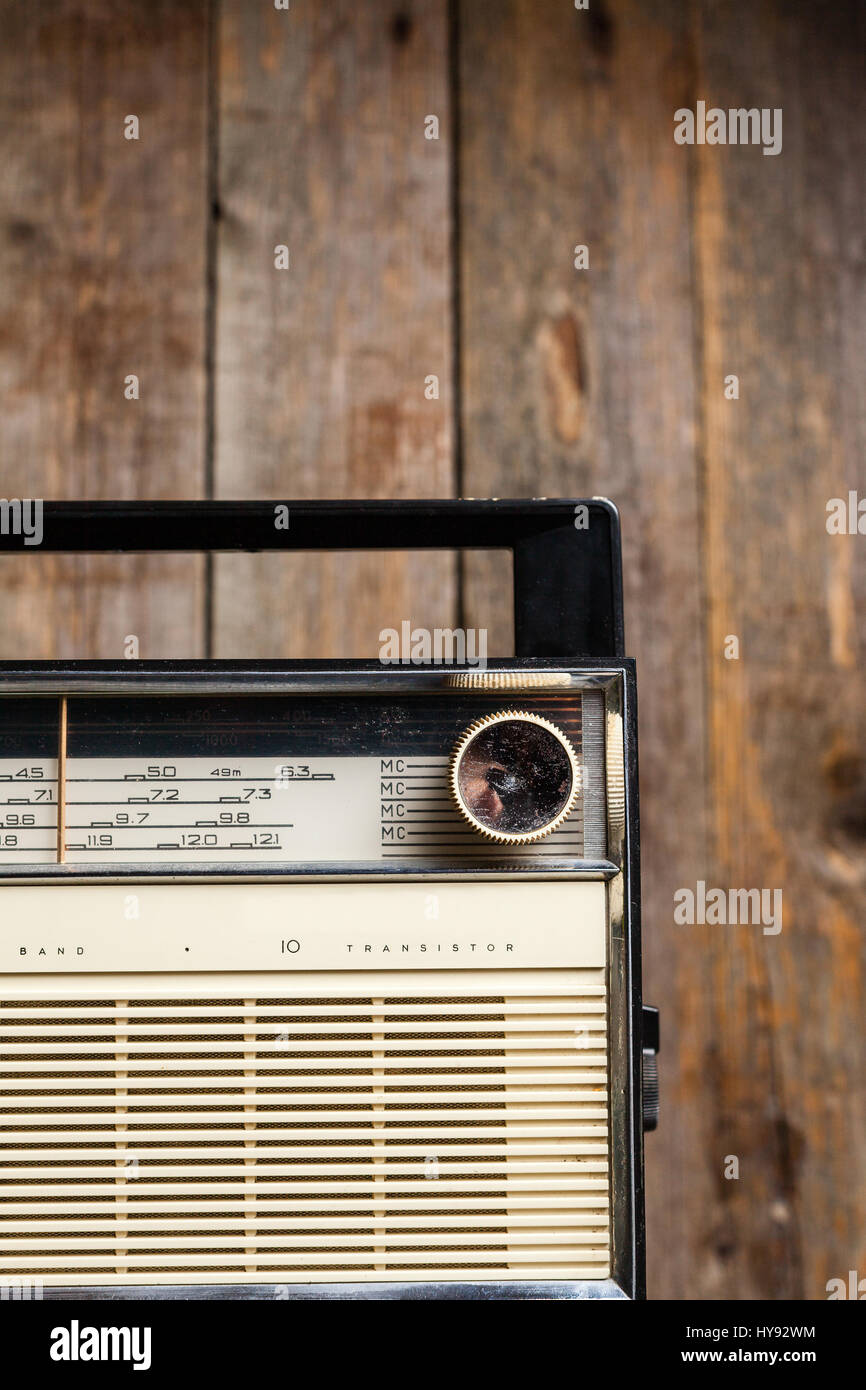 Old vintage radio on a wooden background Stock Photo - Alamy