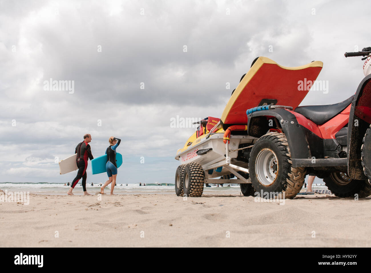 Two body boarders walking on Gwithian beach Cornwall, UK Stock Photo ...