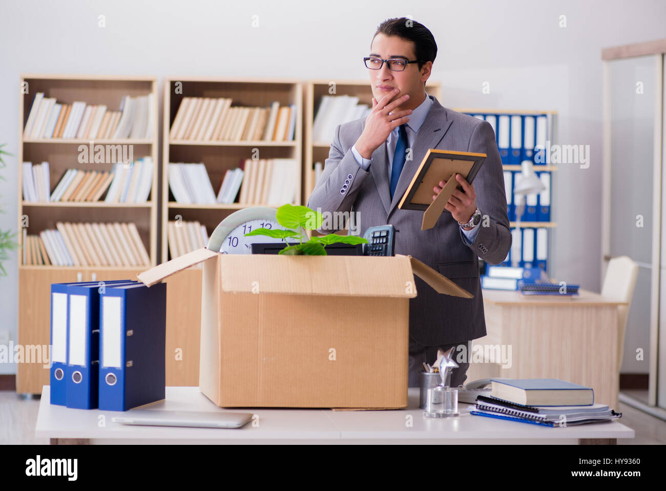 Man moving office with box and his belongings Stock Photo - Alamy