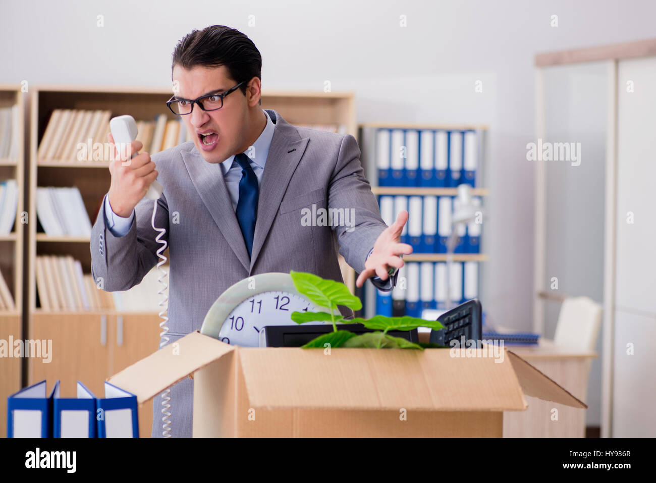 Man moving office with box and his belongings Stock Photo - Alamy
