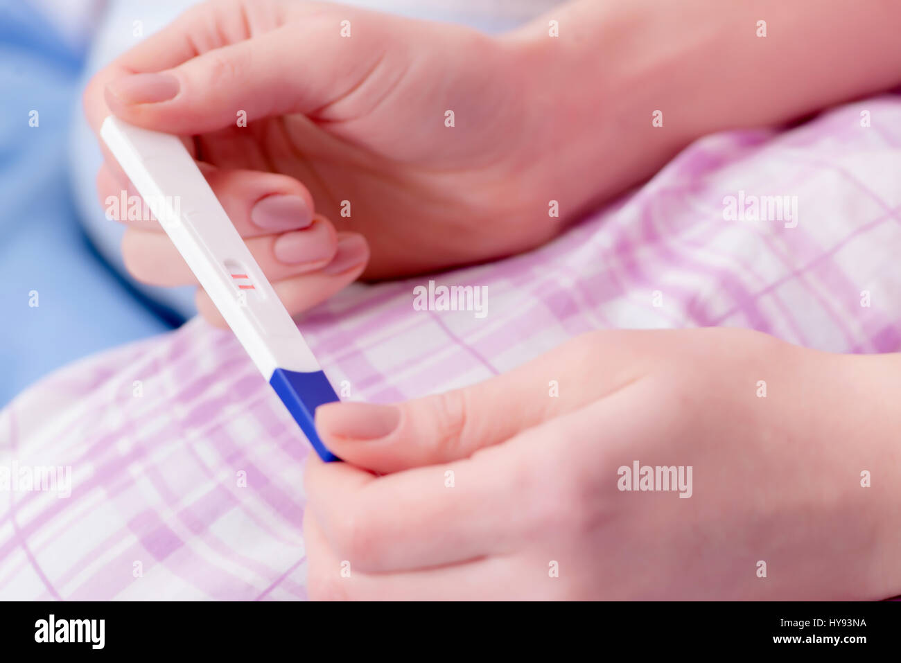Woman discovering her positive pregnancy test Stock Photo - Alamy