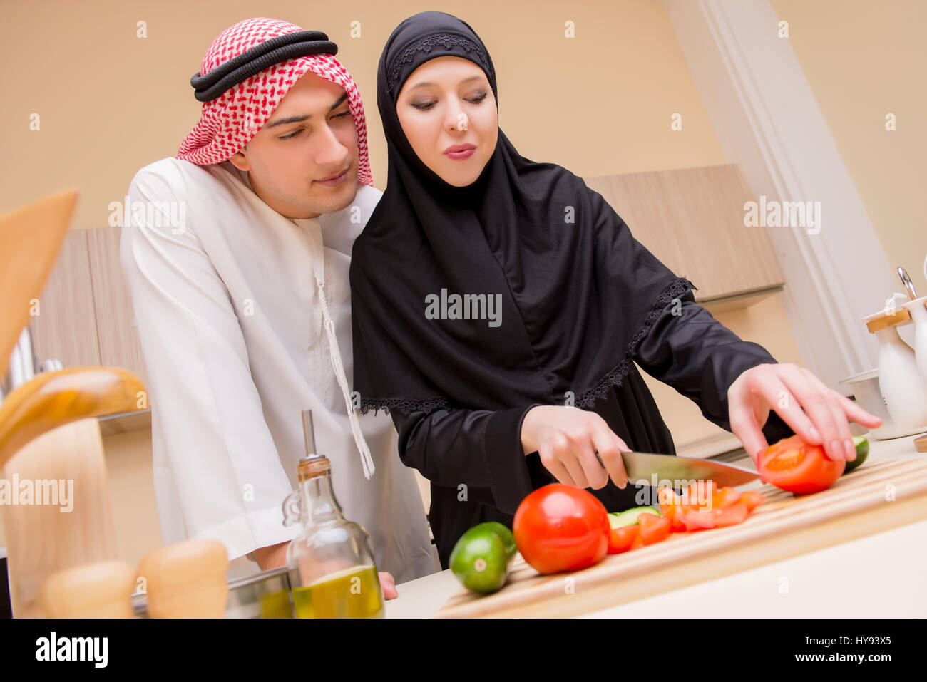 Young arab family in the kitchen Stock Photo - Alamy