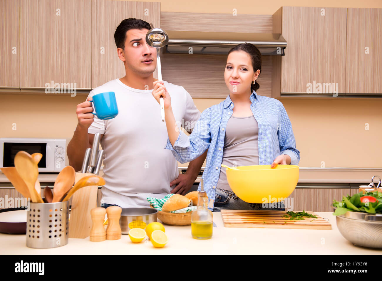 Young family in the kitchen Stock Photo - Alamy