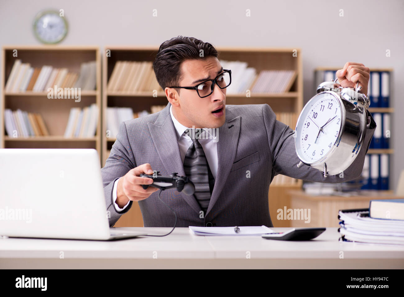 Businessman playing computer games at work office Stock Photo - Alamy