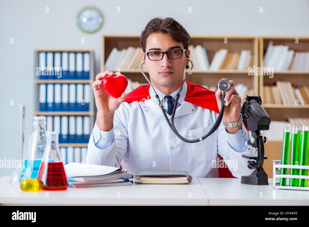 Superhero doctor working in the hospital lab Stock Photo - Alamy