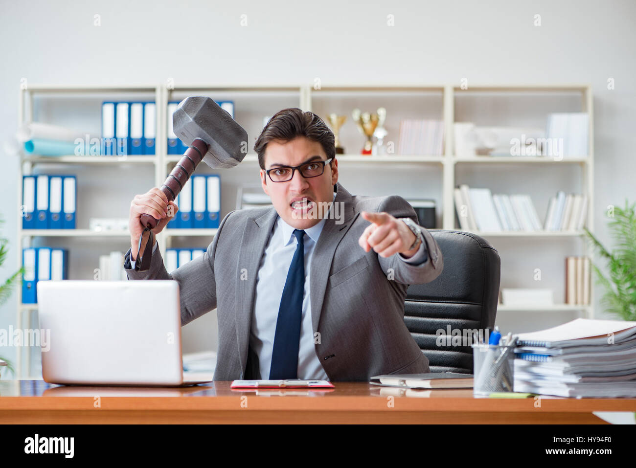 Aggressive man breaking laptop hammer hi-res stock photography and images - Alamy