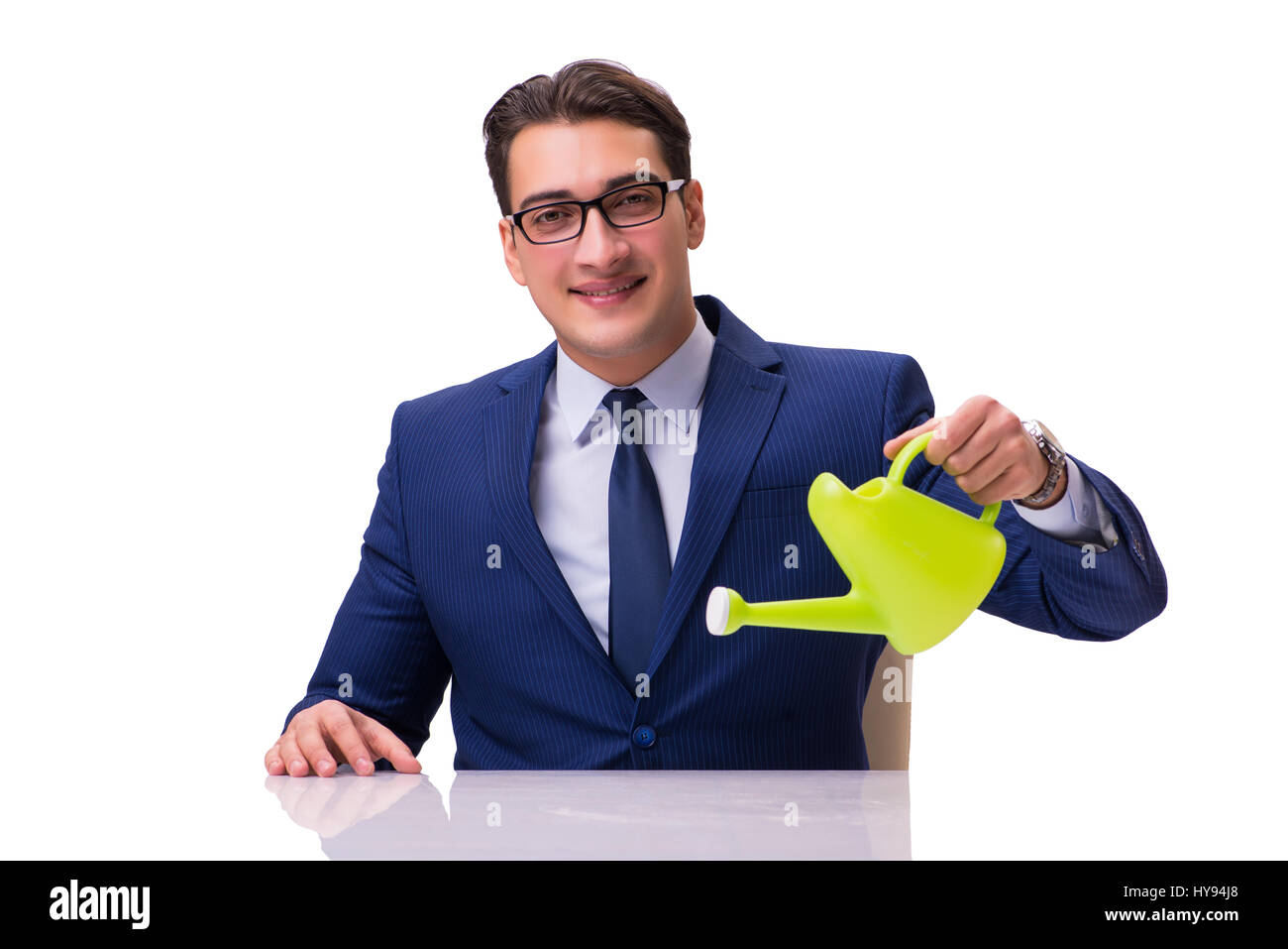 Businessman watering money growing on hi-res stock photography and ...