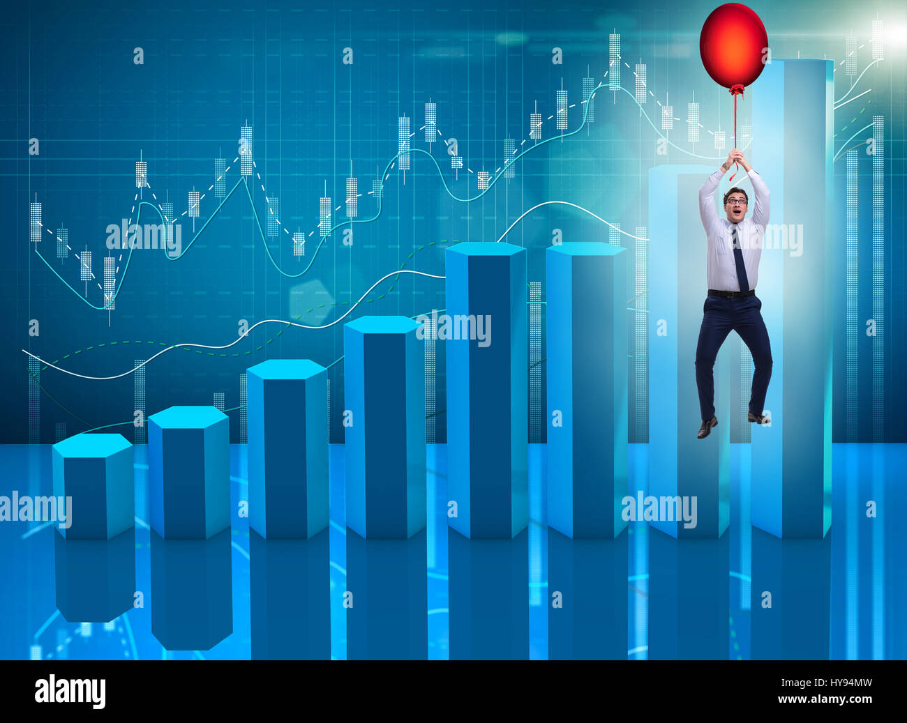 Businessman flying on hot balloon over graph Stock Photo - Alamy