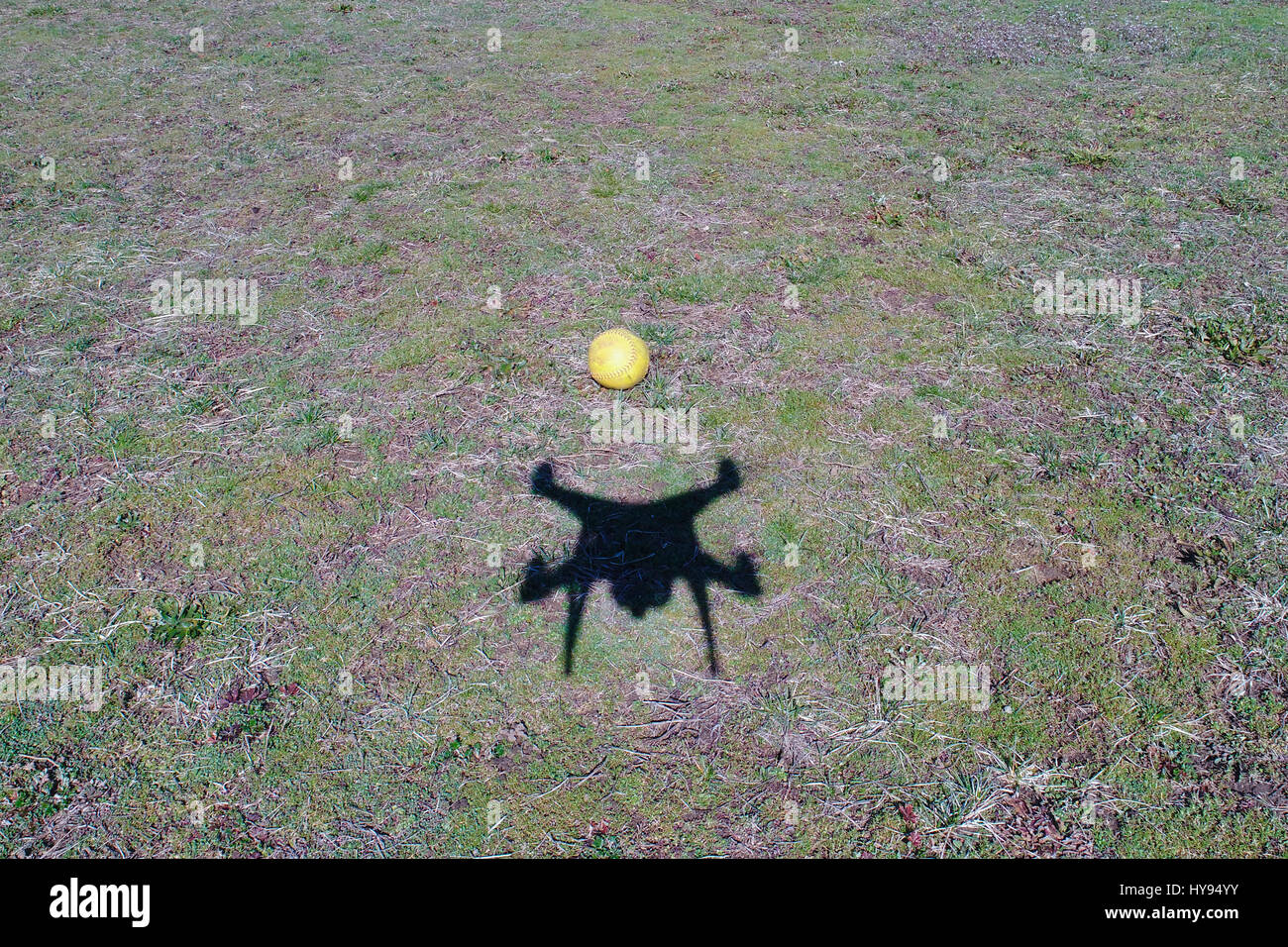 Drone taking picture of a ball , with its shadow Stock Photo - Alamy