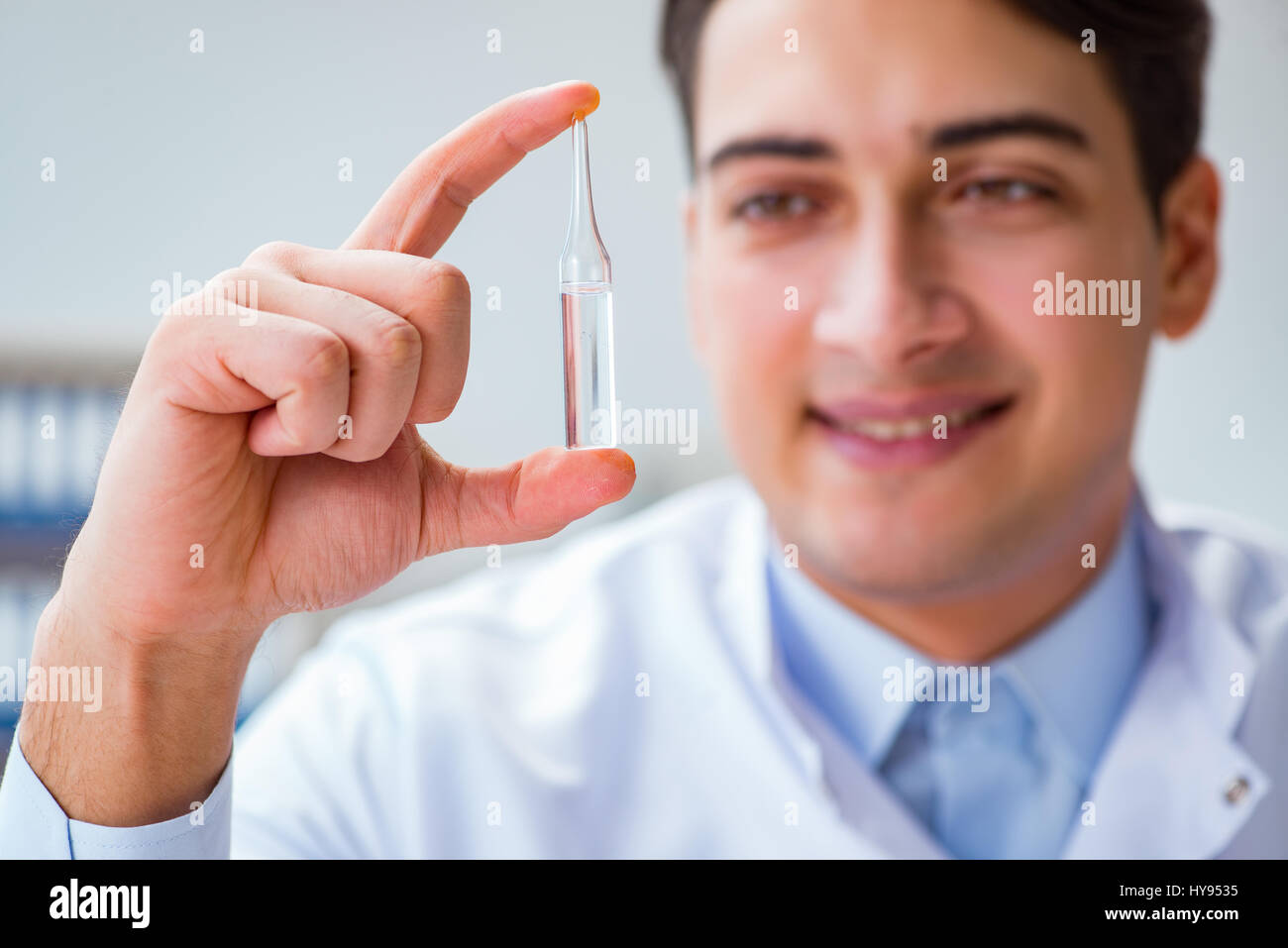 Doctor holding medicines in the lab Stock Photo - Alamy