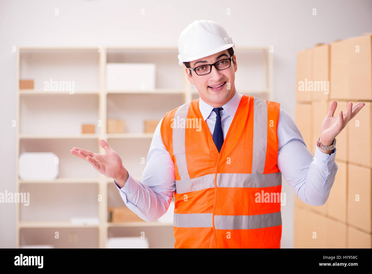 Man working in postal parcel delivery service office Stock Photo - Alamy