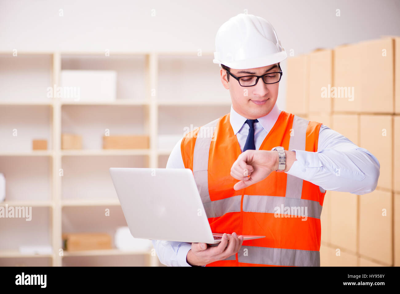 Man working in postal parcel delivery service office Stock Photo - Alamy