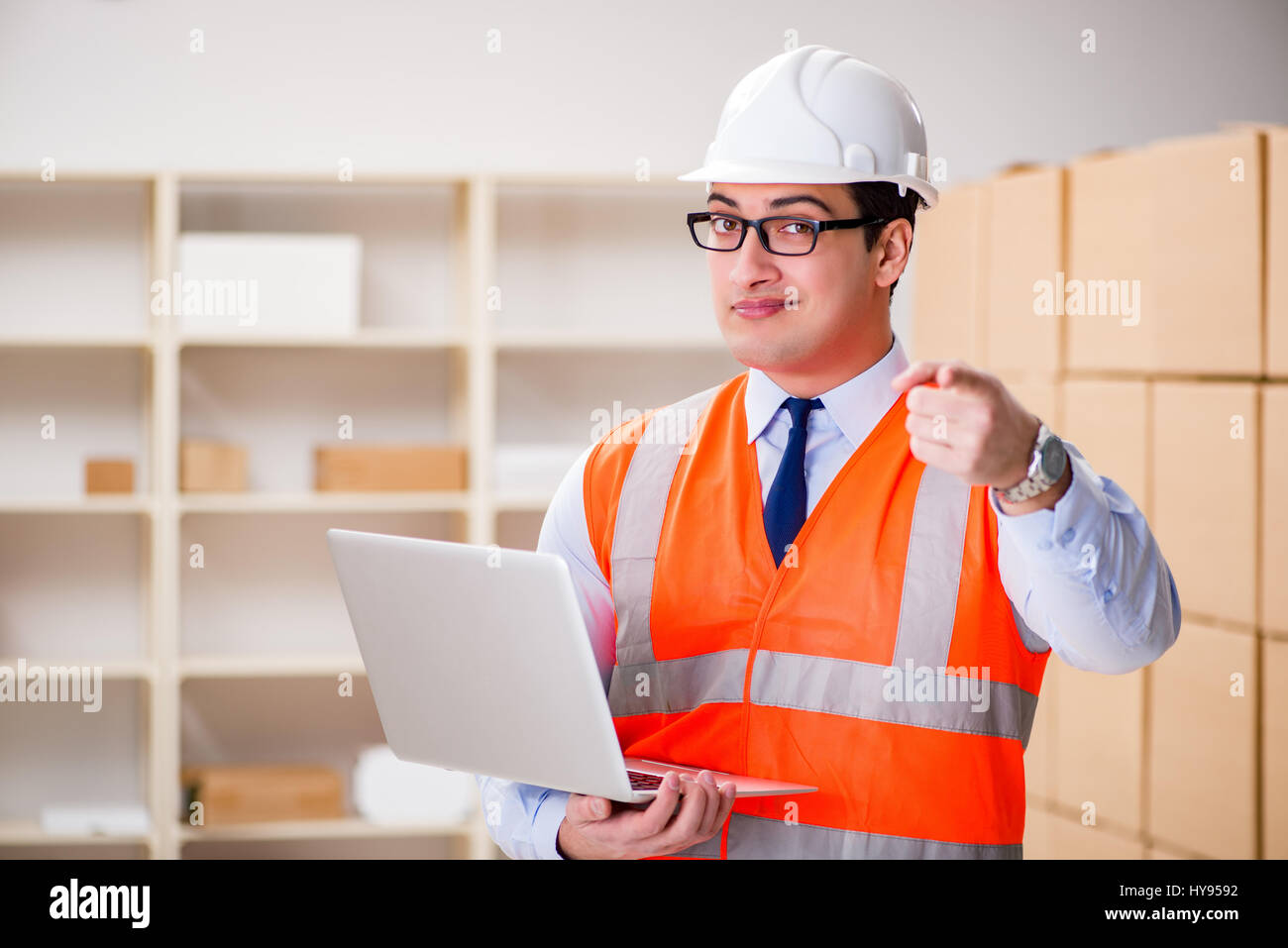 Man working in postal parcel delivery service office Stock Photo - Alamy