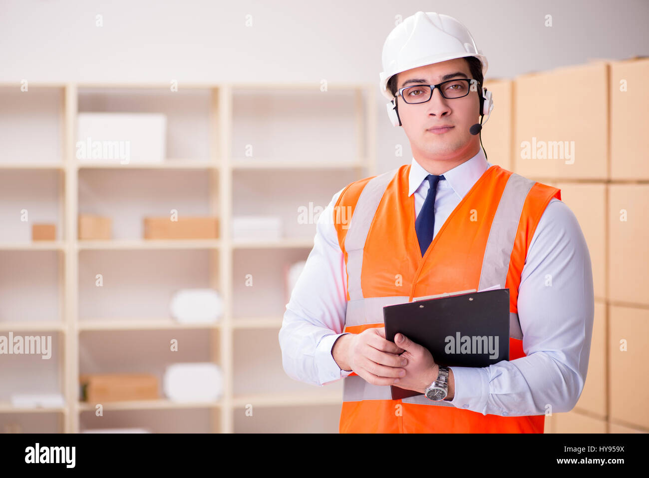 Man working in postal parcel delivery service office Stock Photo - Alamy